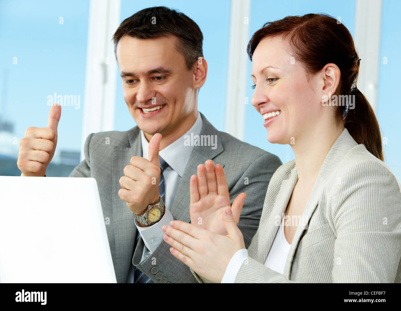 Photo of smart businessman and his secretary showing their idea being ...