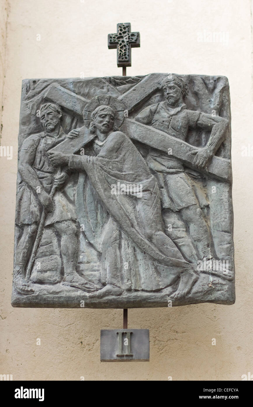 A Bronze plaque of Jesus carrying his cross in the Papal Basilica of ...