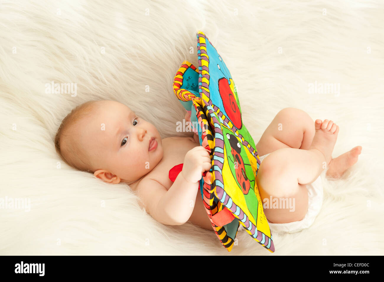Taste of knowledge. Baby's first book Stock Photo - Alamy