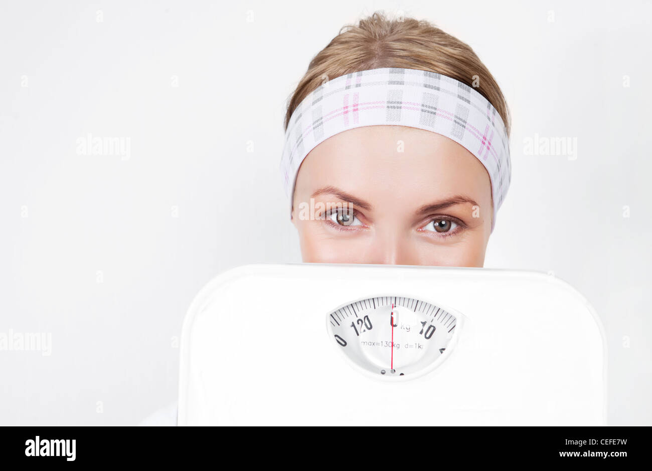 beautiful young woman with scales Stock Photo - Alamy
