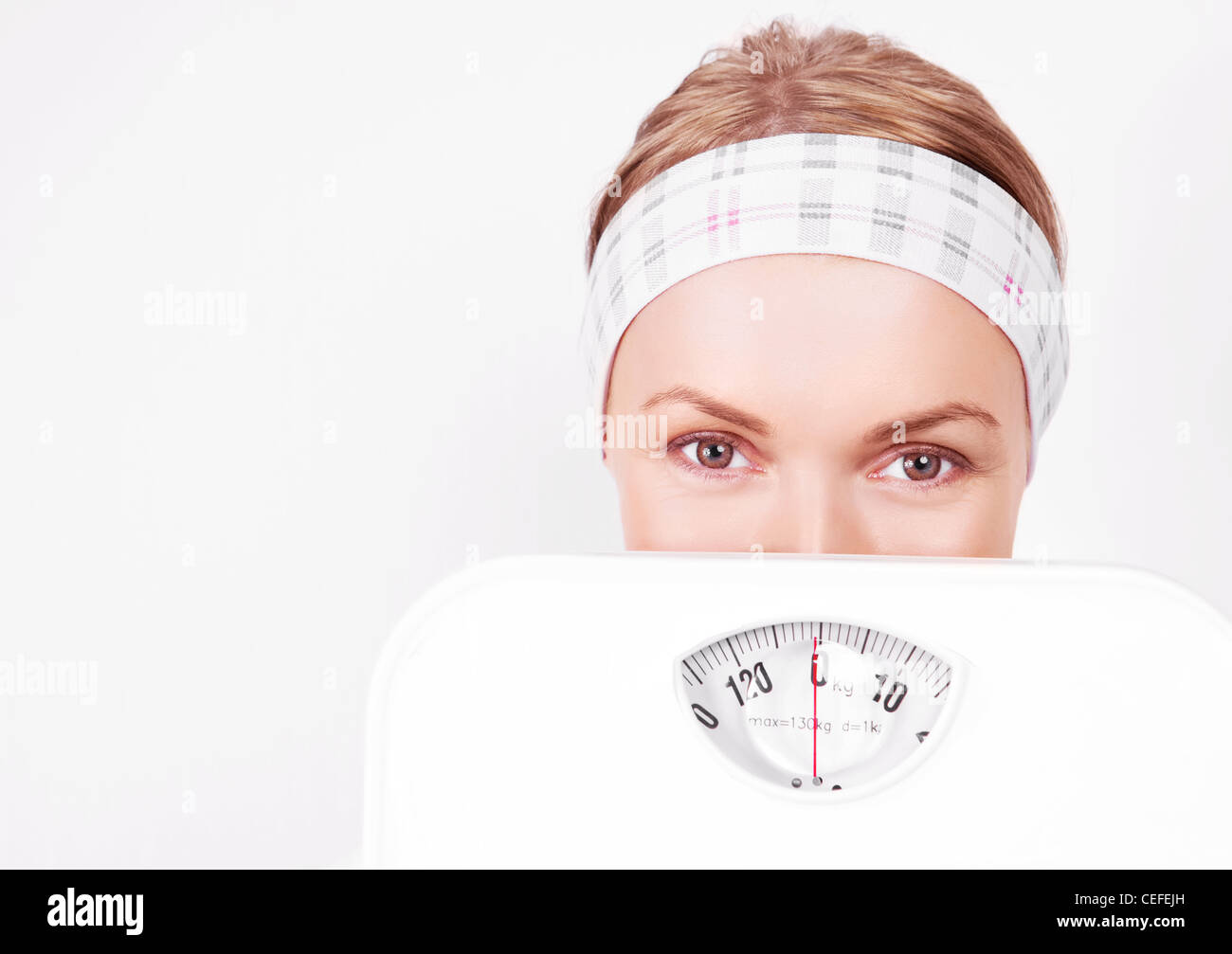 beautiful young woman with scales Stock Photo - Alamy