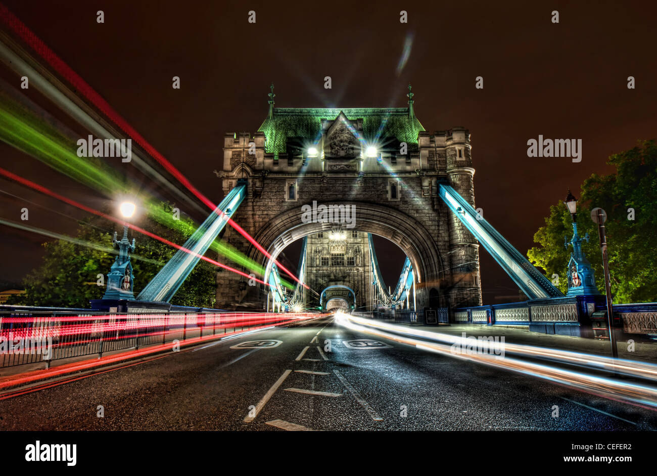 Traffic trails passing over Tower Bridge through the archways Stock ...