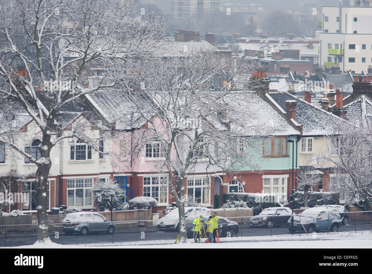 Snow covered rooftops of south London residential houses, some with ...