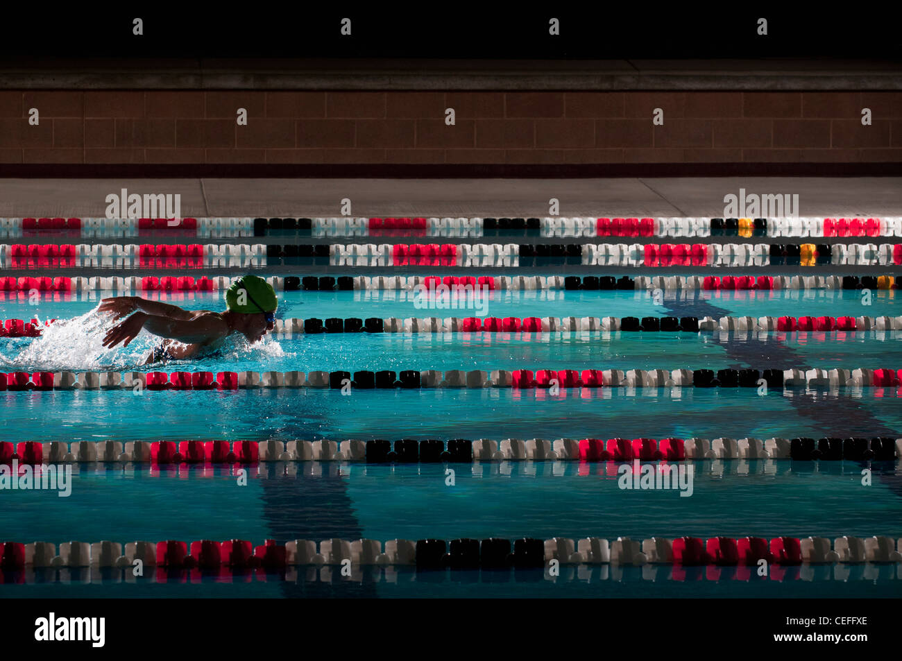 Woman swimming laps in pool Stock Photo - Alamy