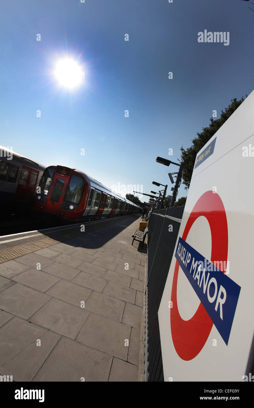 Metropolitan tube train departing from Ruislip Manor Station Stock ...