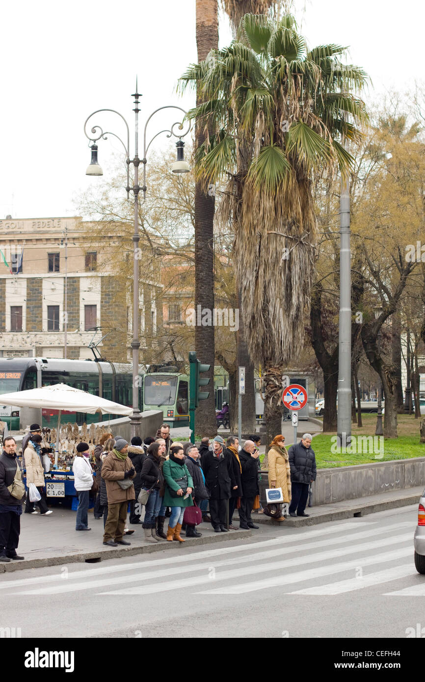 Crowd of people waiting to cross a road in Rome Italy Stock Photo - Alamy