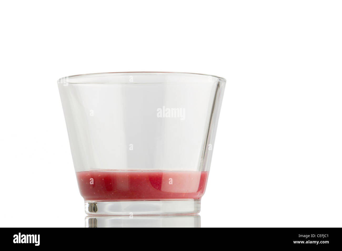 Almost empty glass with smoothie Stock Photo - Alamy