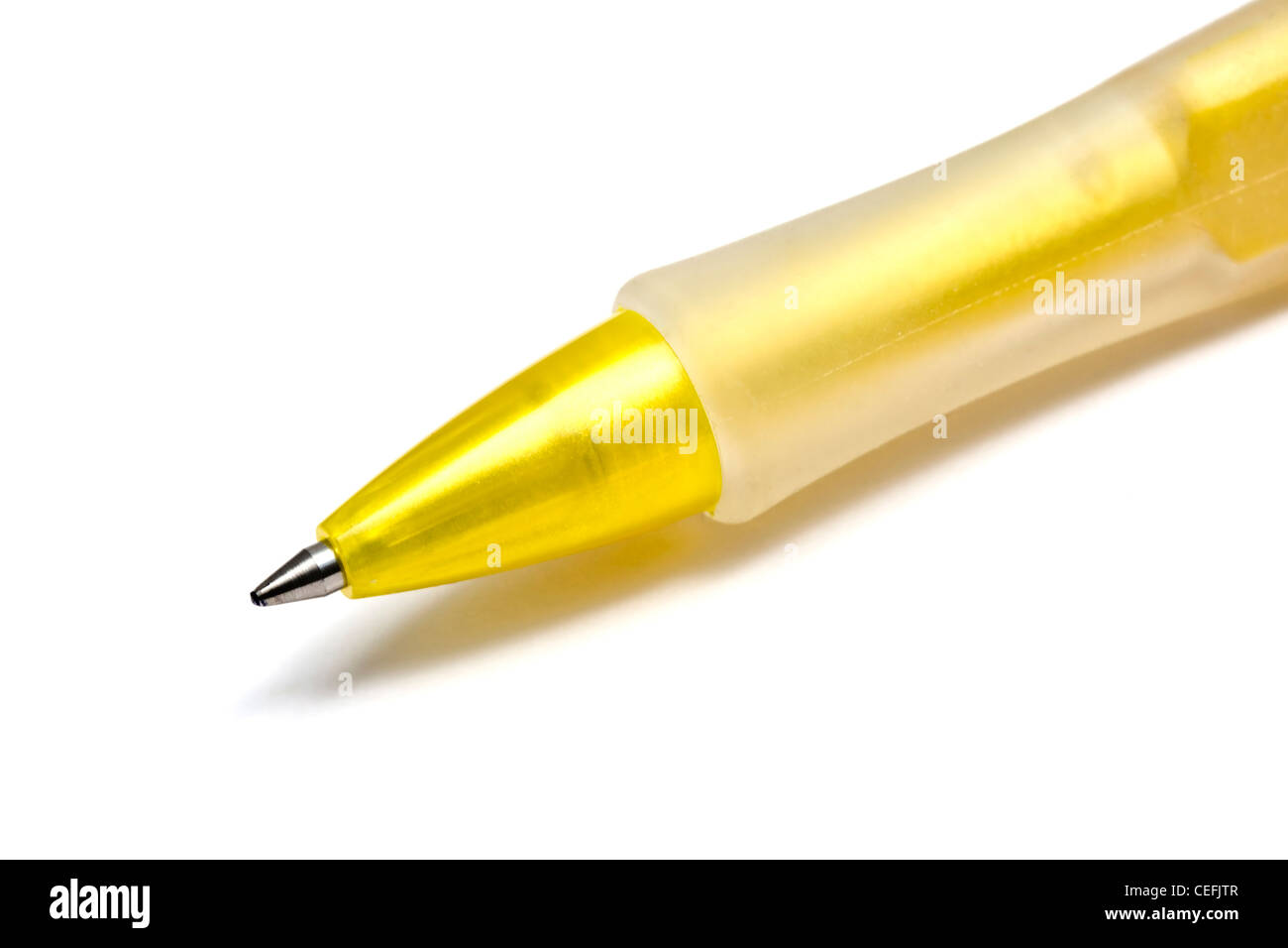 Yellow pen closeup on the white background Stock Photo - Alamy
