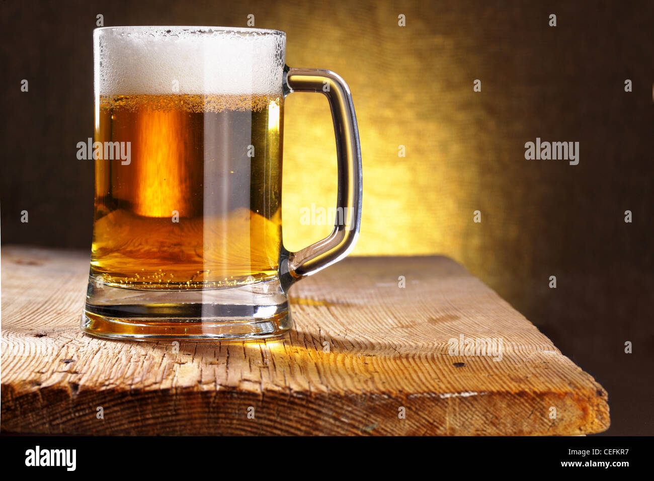 Beer mug close-up on the wood table Stock Photo - Alamy