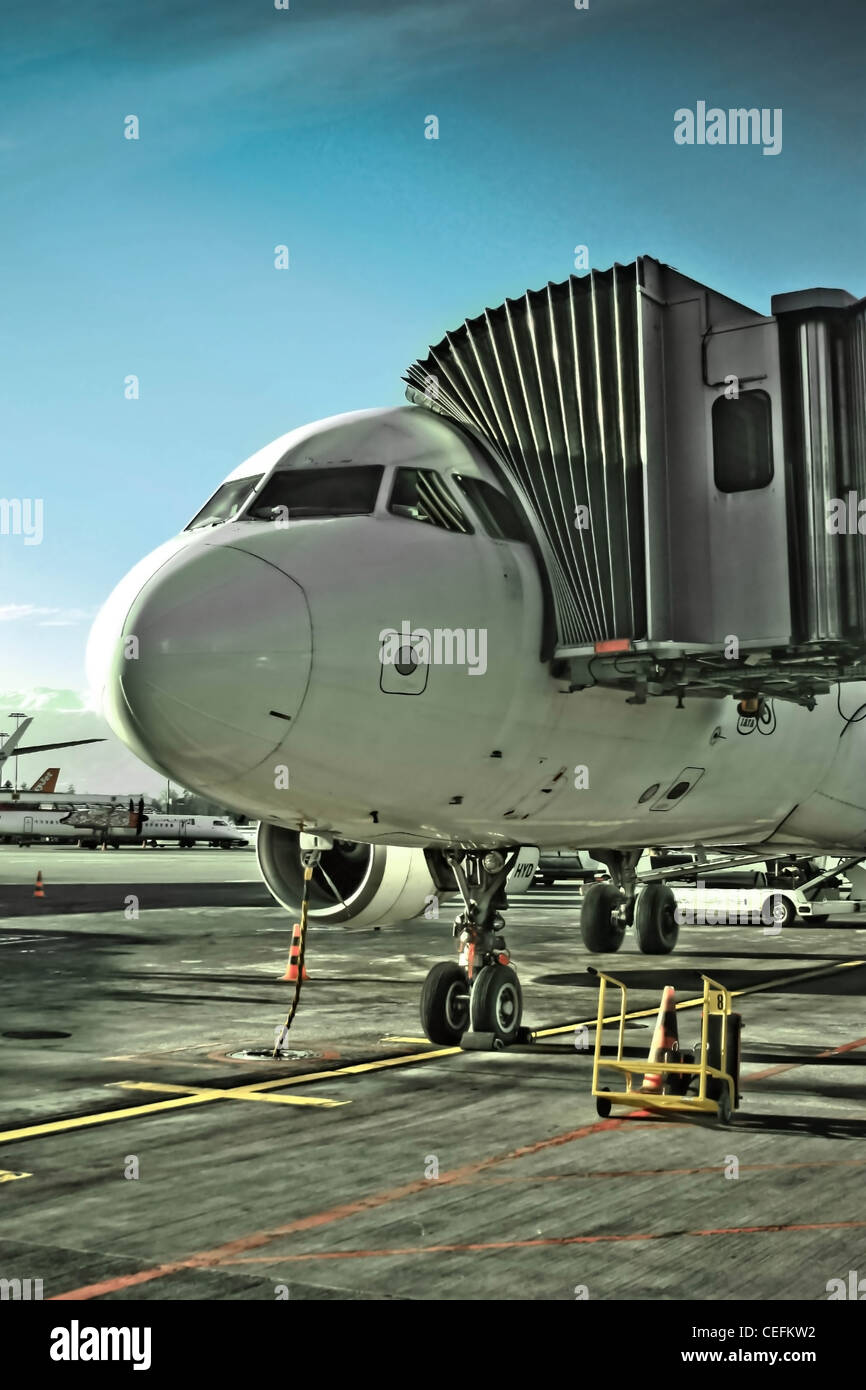 Plane Connected to Airbridge Stock Photo - Alamy
