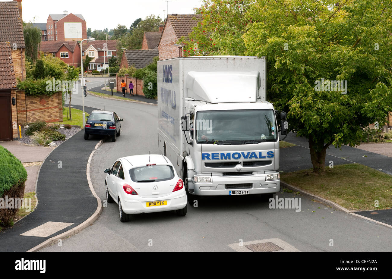 Removals lorry arriving on a housing estate in England Stock Photo - Alamy