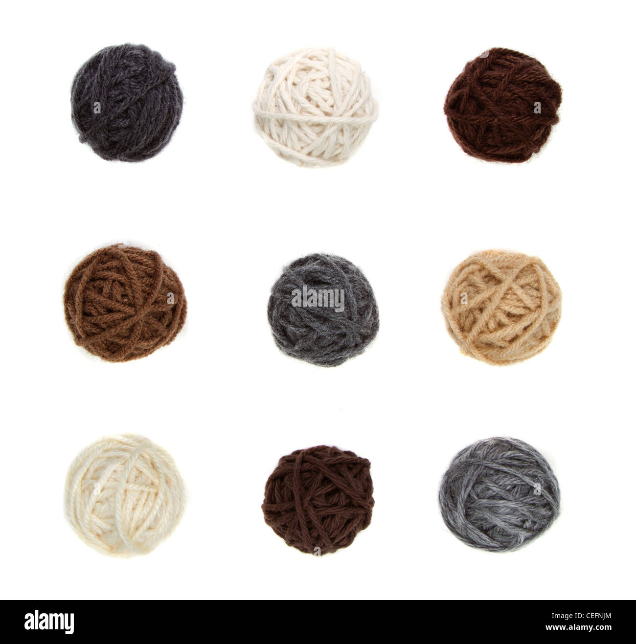 Nine different balls of yarn in neutral colors isolated on a white ...