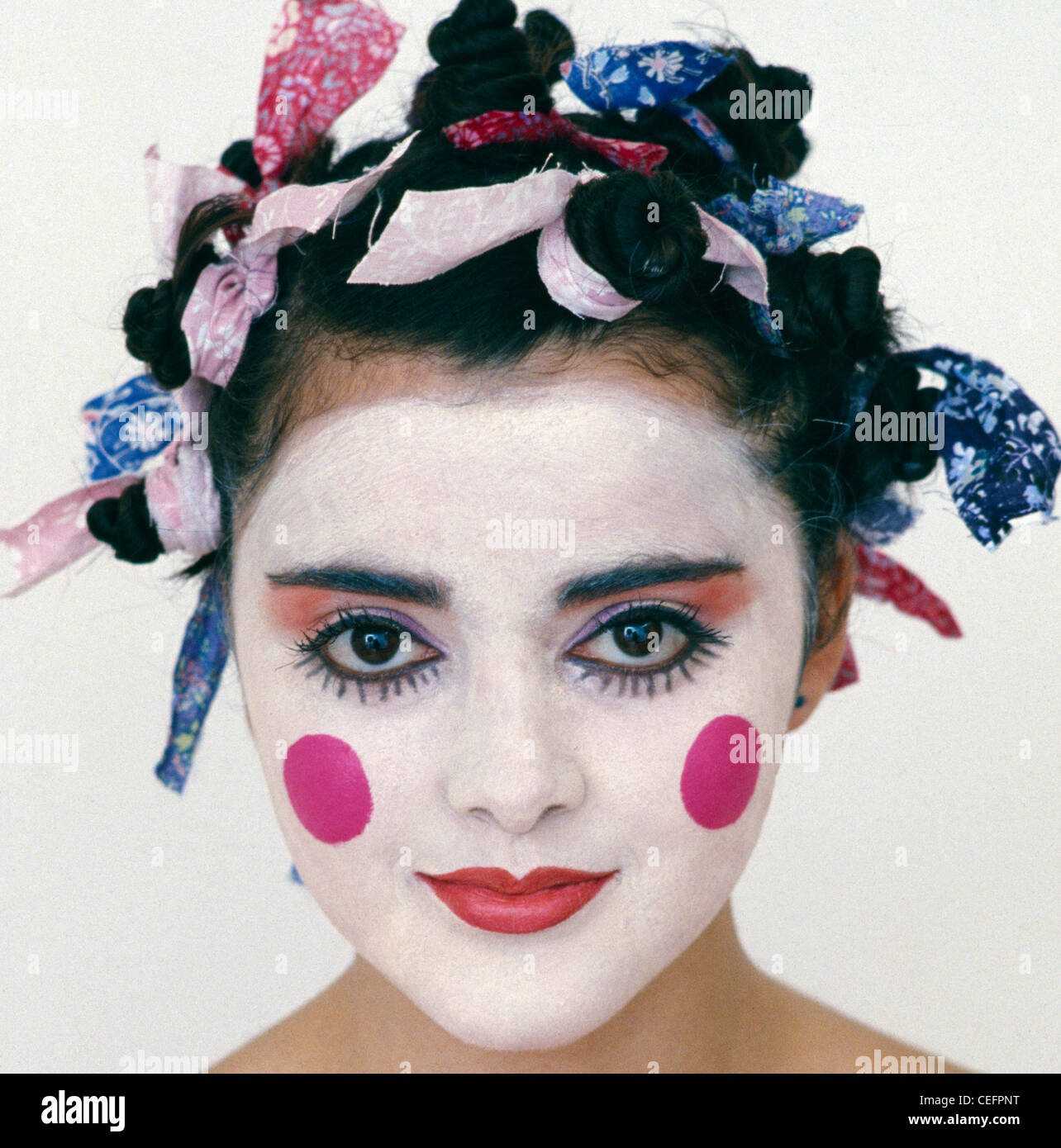 Model made up as rag doll, hair in rags to produce ringlets Stock Photo ...