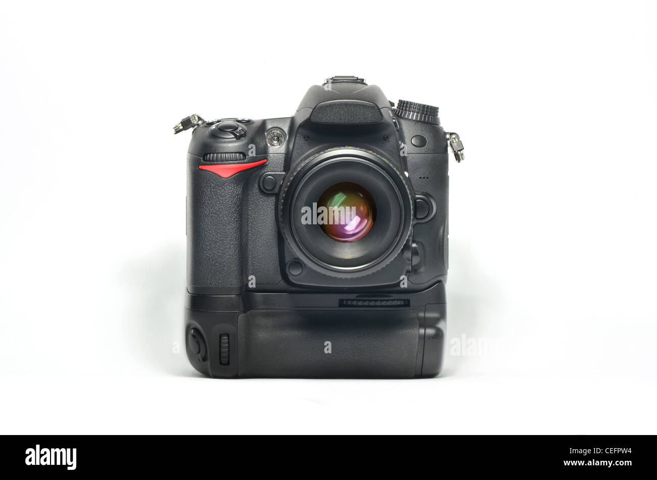 Front view of a professional DSLR with its battery pack, mounted with a ...