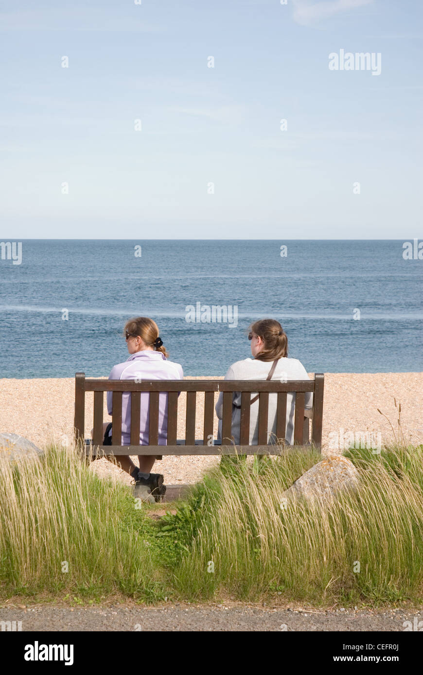 Two Ladies On A Bench At Torcross In South Devon Stock Photo - Alamy