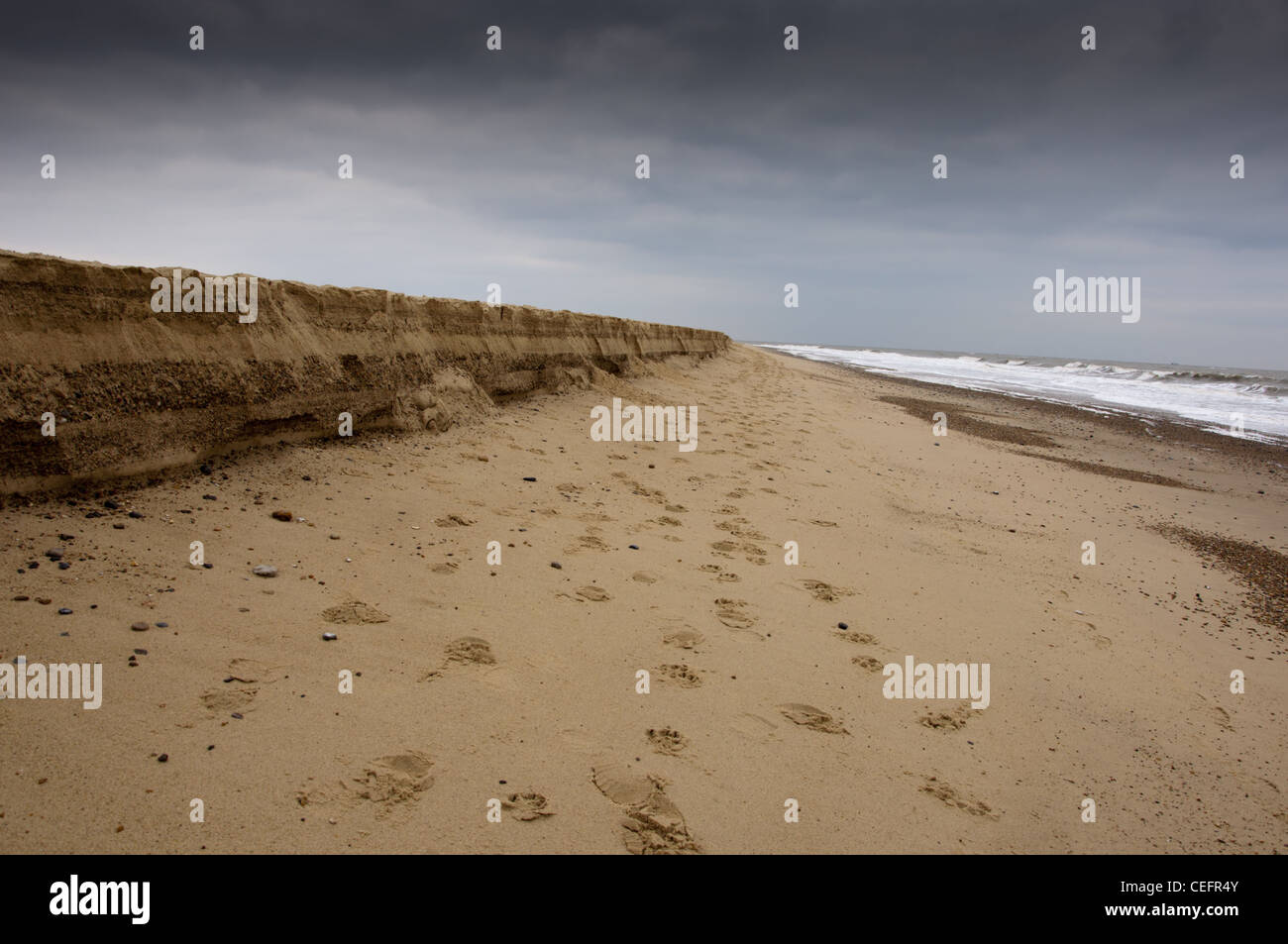 Sand beach erosion after storm Stock Photo - Alamy