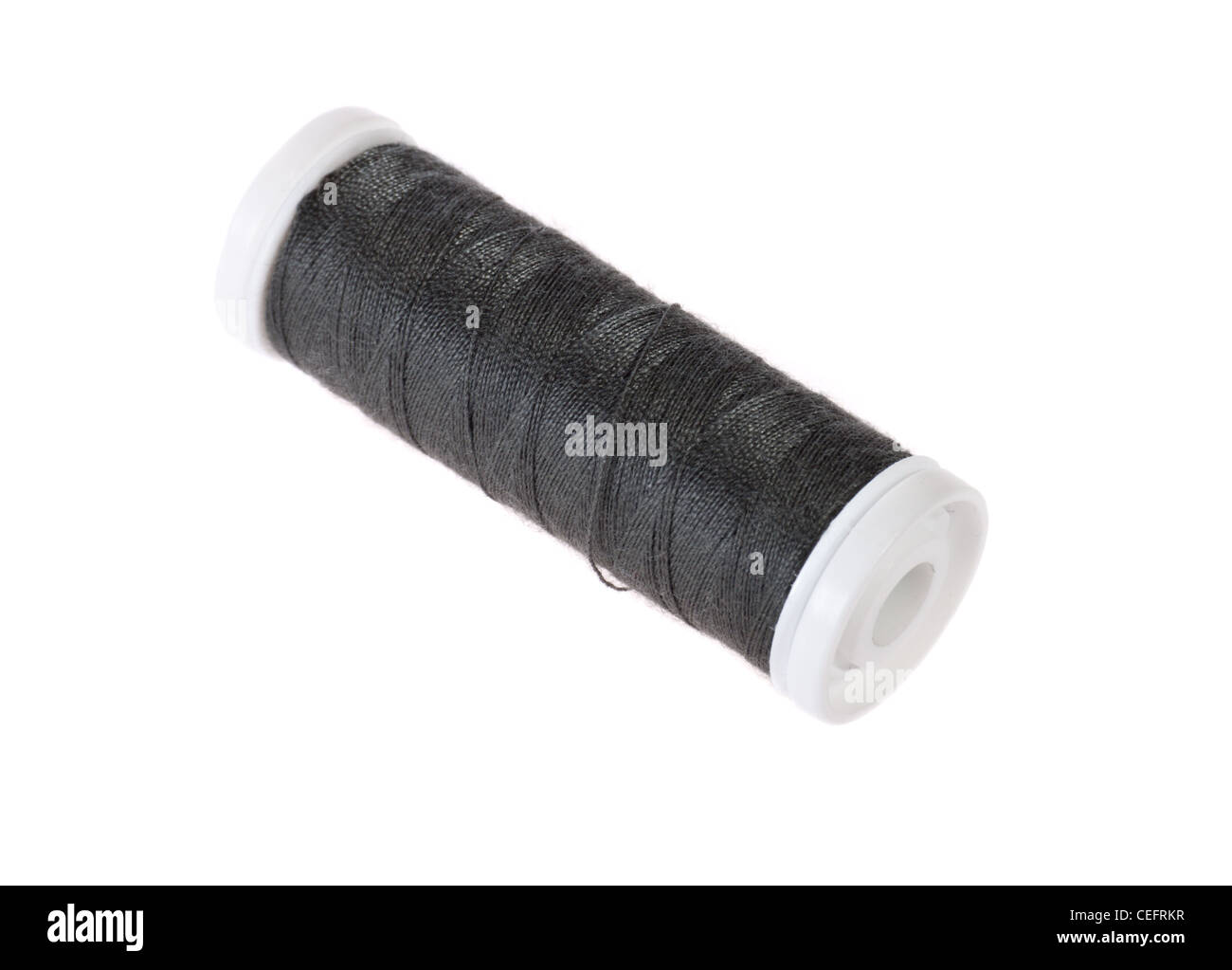 Black bobbin thread isolated on white Stock Photo - Alamy