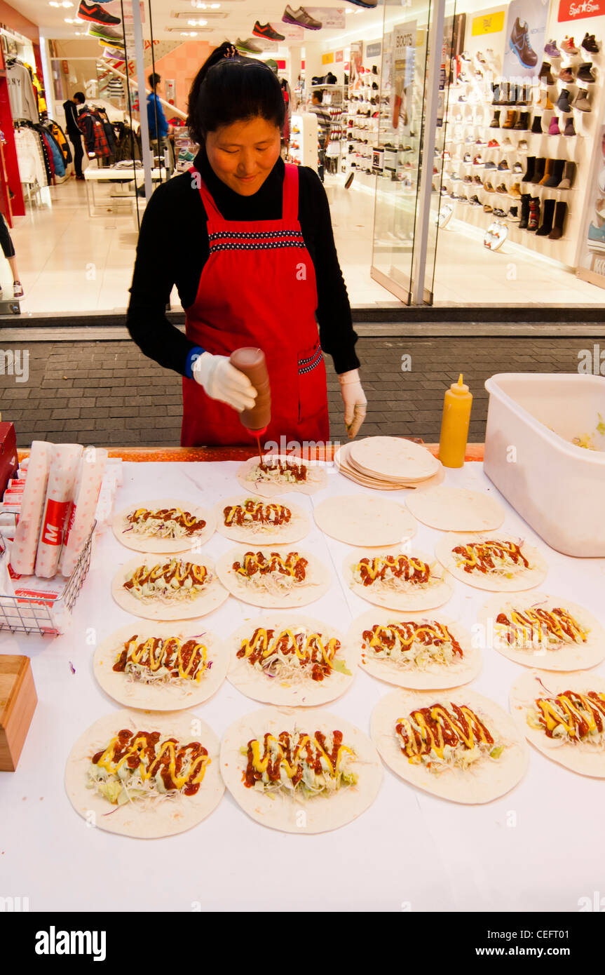 Streets food stalls selling various foods and snacks in the evening in ...