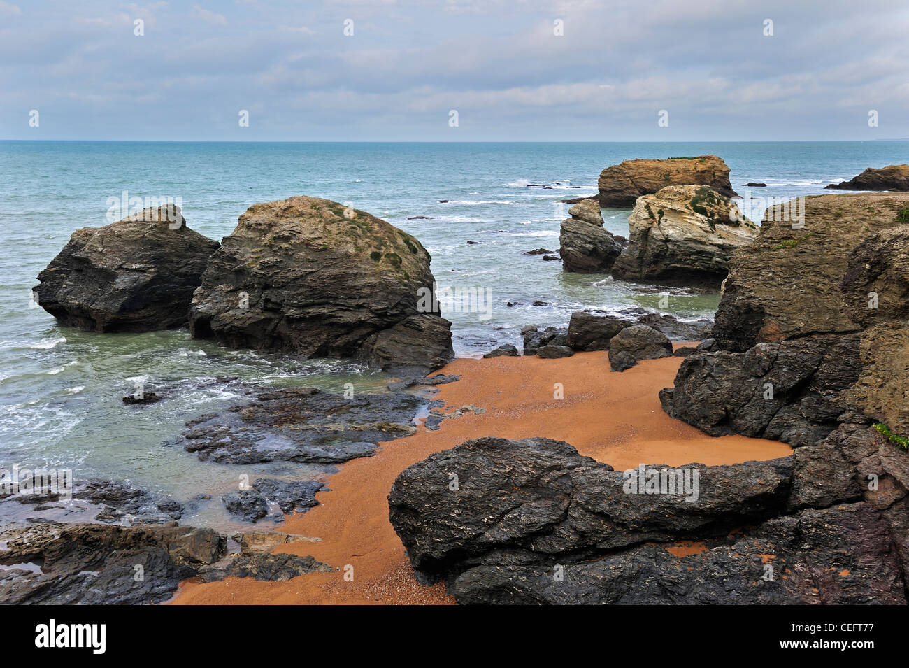 Eroded sea stacks at the Plage des Cinq Pineaux at Saint-Hilaire-de ...