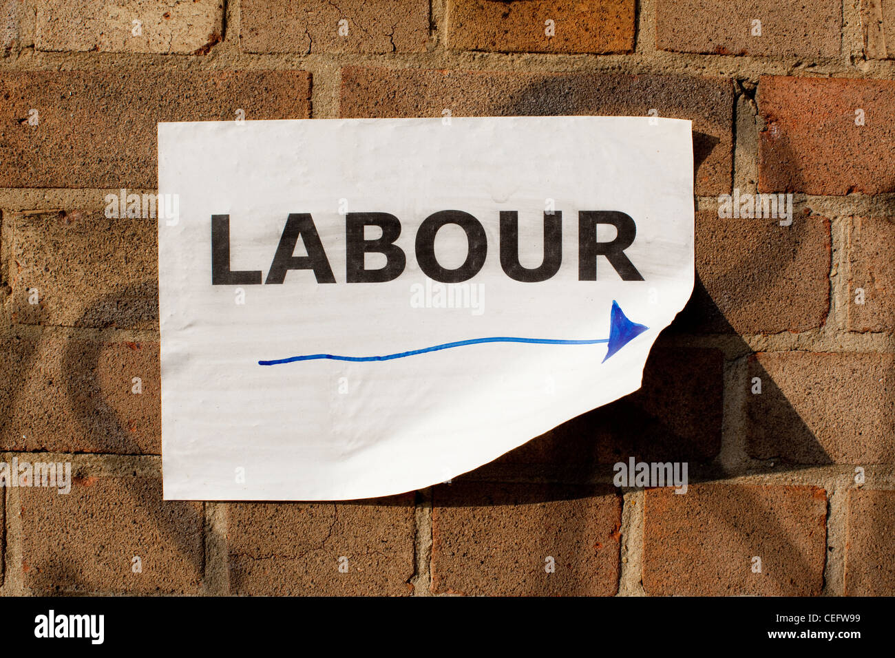 Labour sign indicating where contractors go for manual work at ...