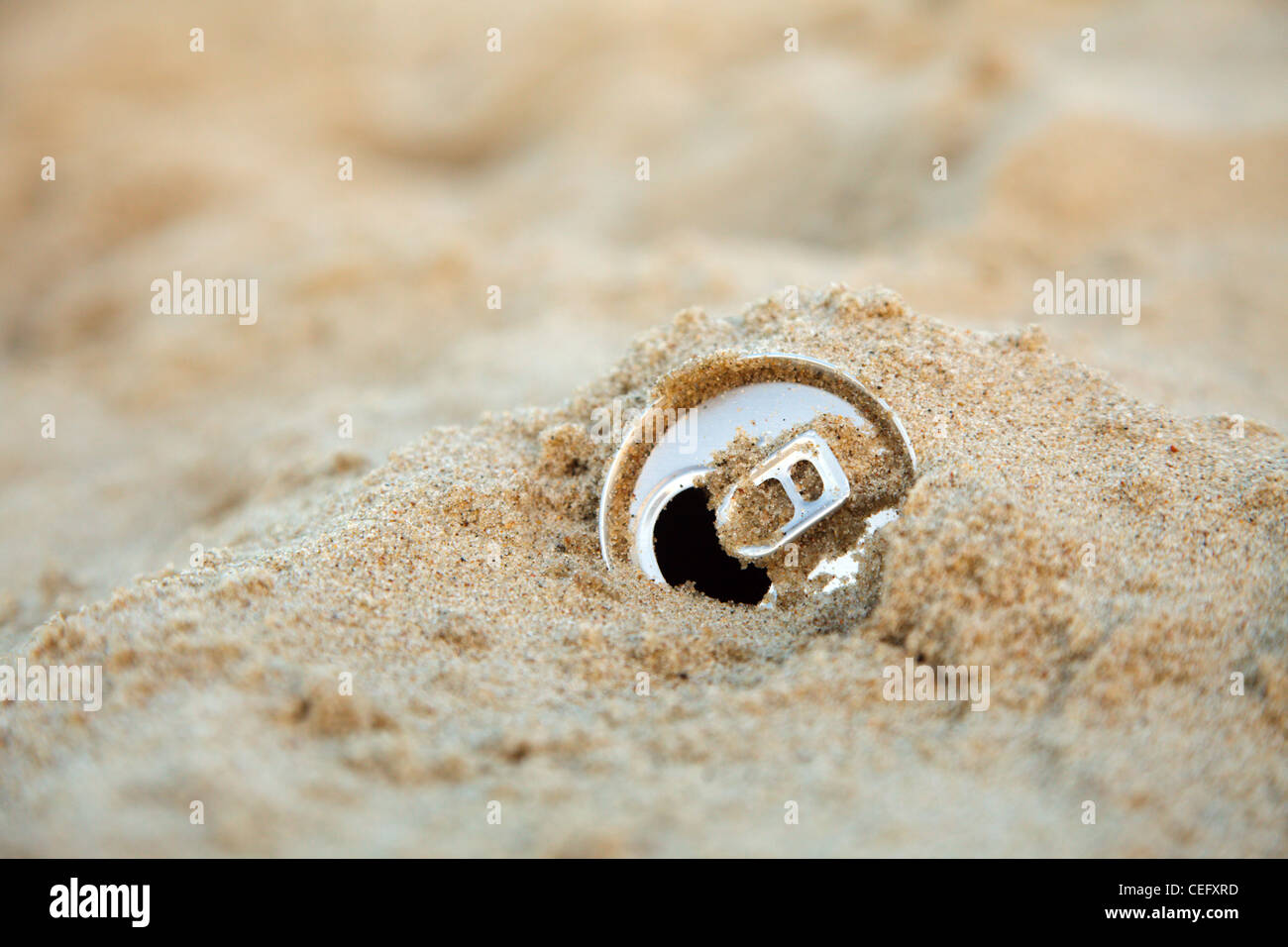Discarded aluminum can in the sand Stock Photo - Alamy