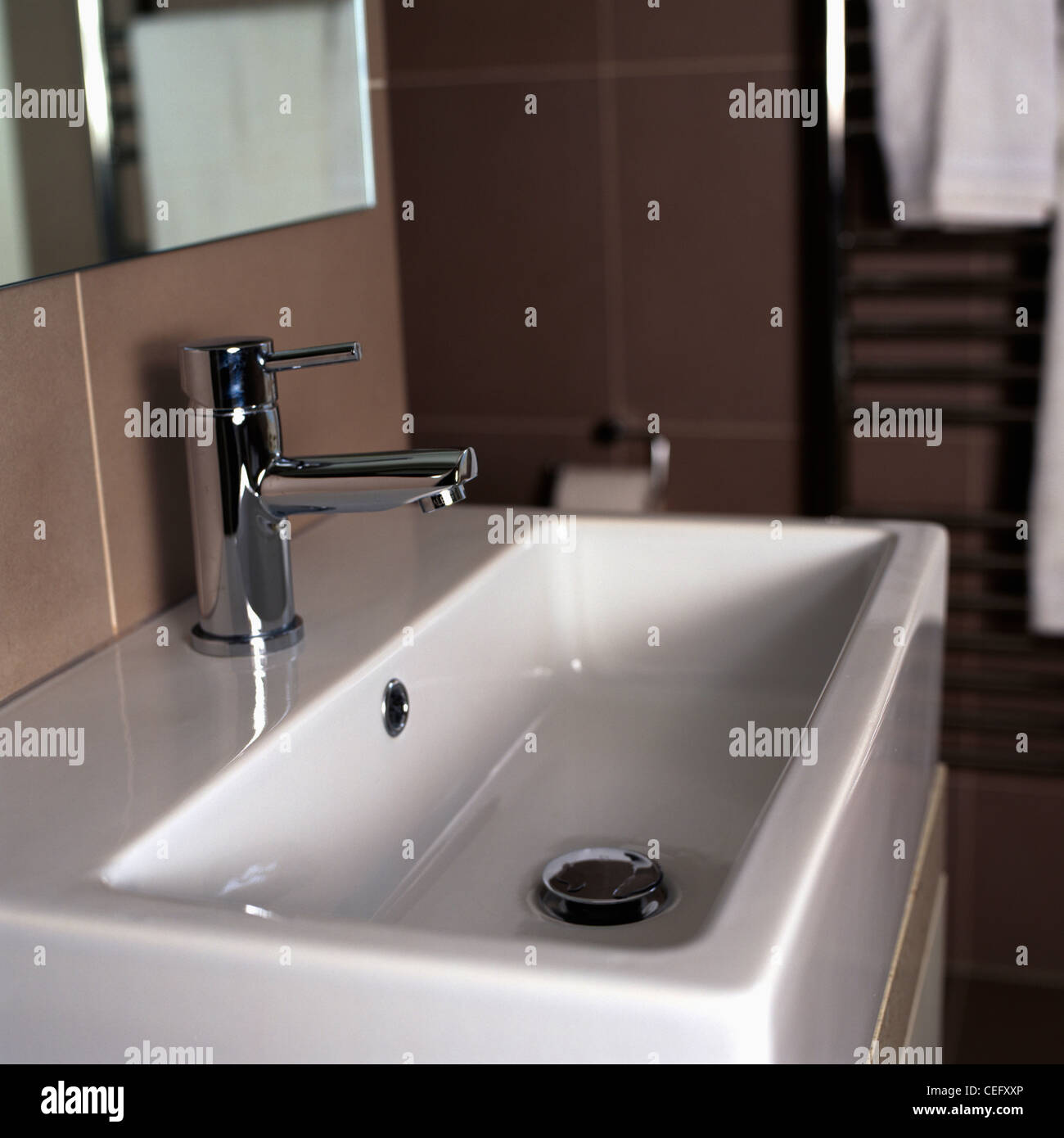 Close up of chrome tap and rectangular white ceramic basin Stock Photo ...