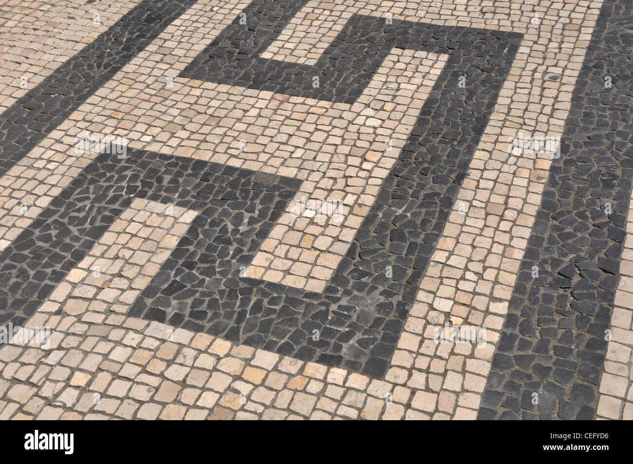 portuguese typical pavement known as calcada or cobblestone (hand-made ...