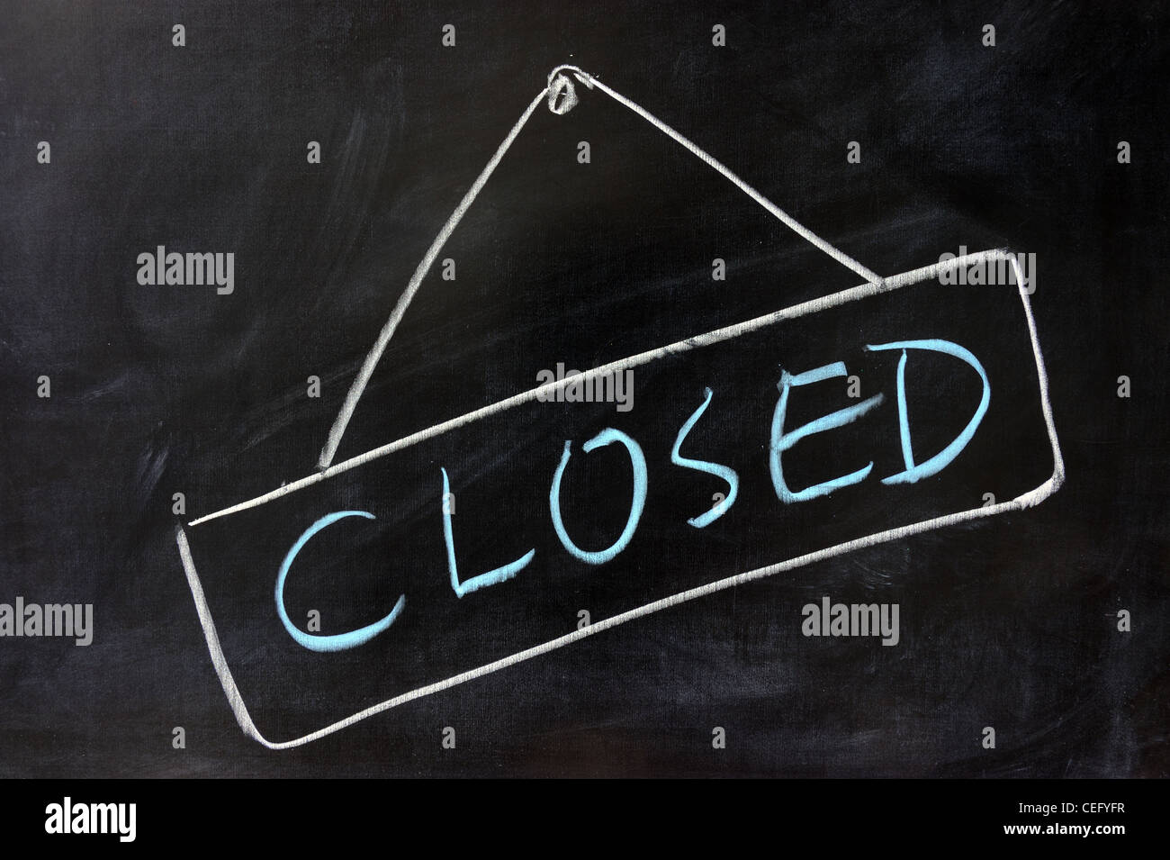 Chalk drawing - 'Closed' word written on chalkboard Stock Photo - Alamy