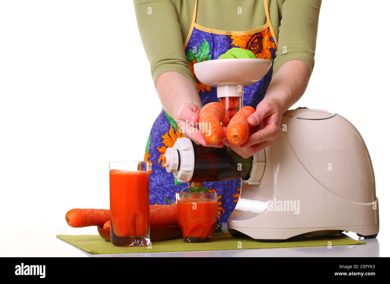 Woman Juice extractor and carrot isolated white kitchen prepare Stock ...