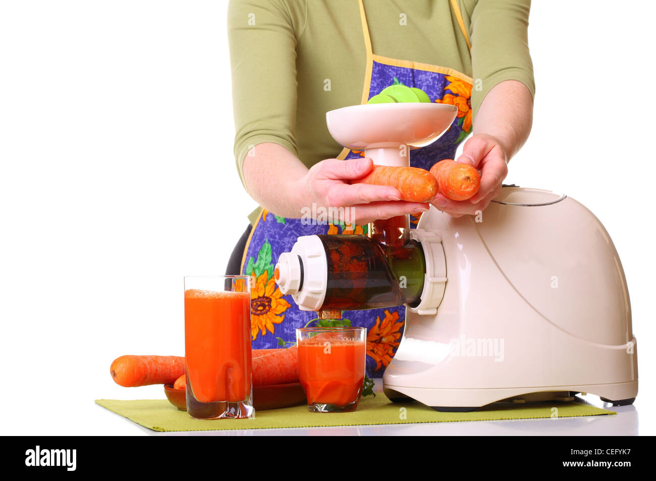 Woman Juice extractor and carrot isolated white kitchen prepare Stock ...