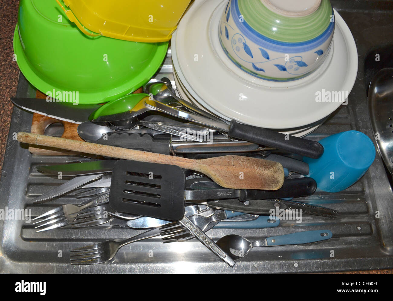 clean stack of dishes and cutlery Stock Photo - Alamy