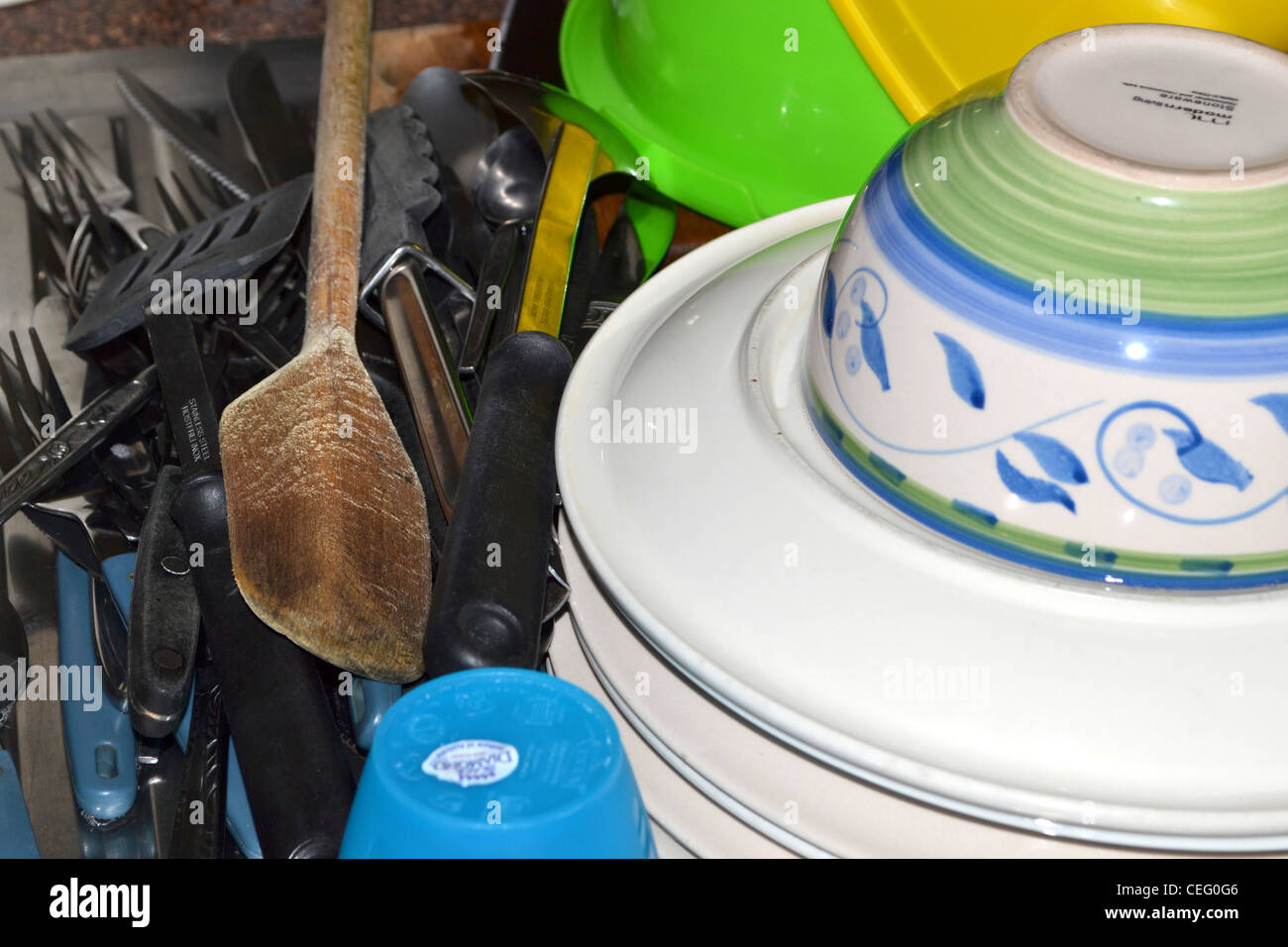 clean stack of dishes and cutlery Stock Photo - Alamy