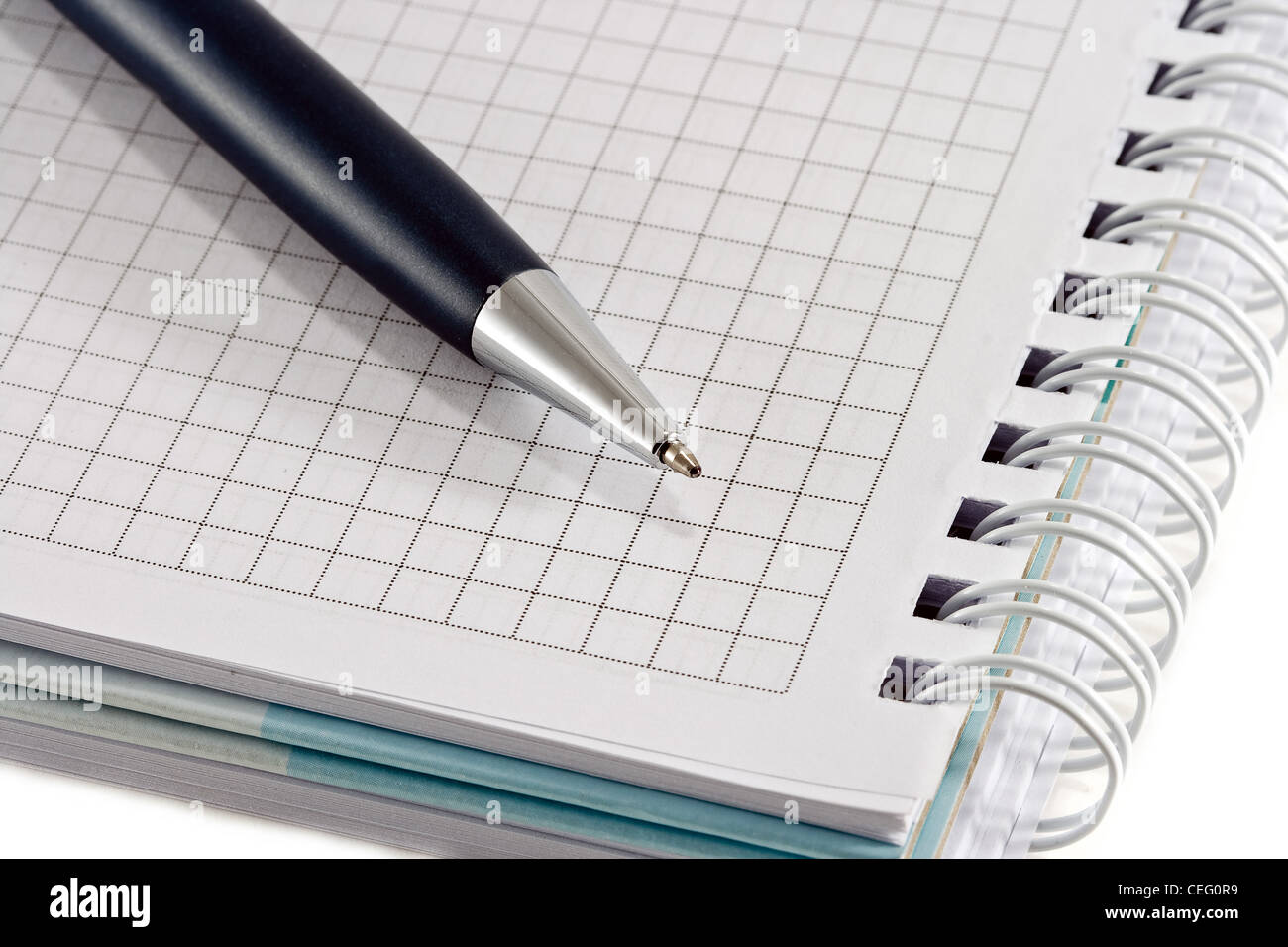 Blue pen with notebook closeup Stock Photo - Alamy