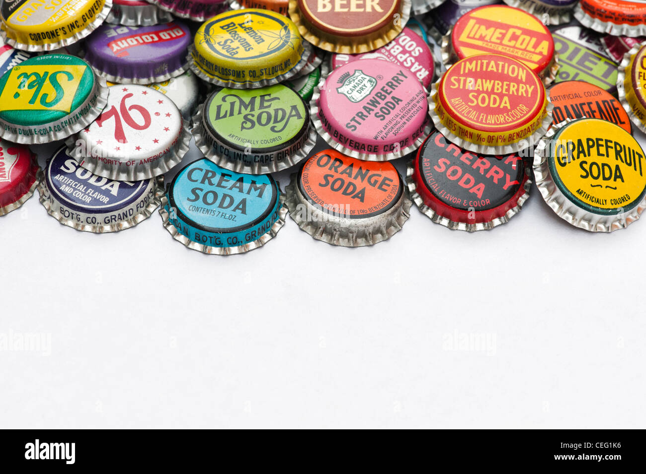 Retro American Soda bottle caps on white background Stock Photo - Alamy