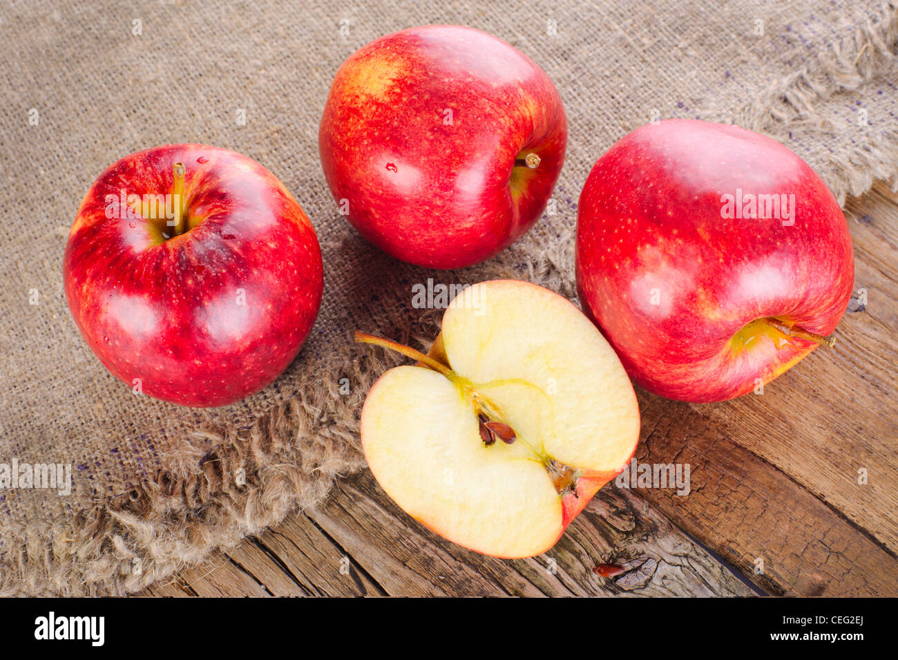 Ripe apple fruits on old wooden table with canvas tablecloth Stock ...