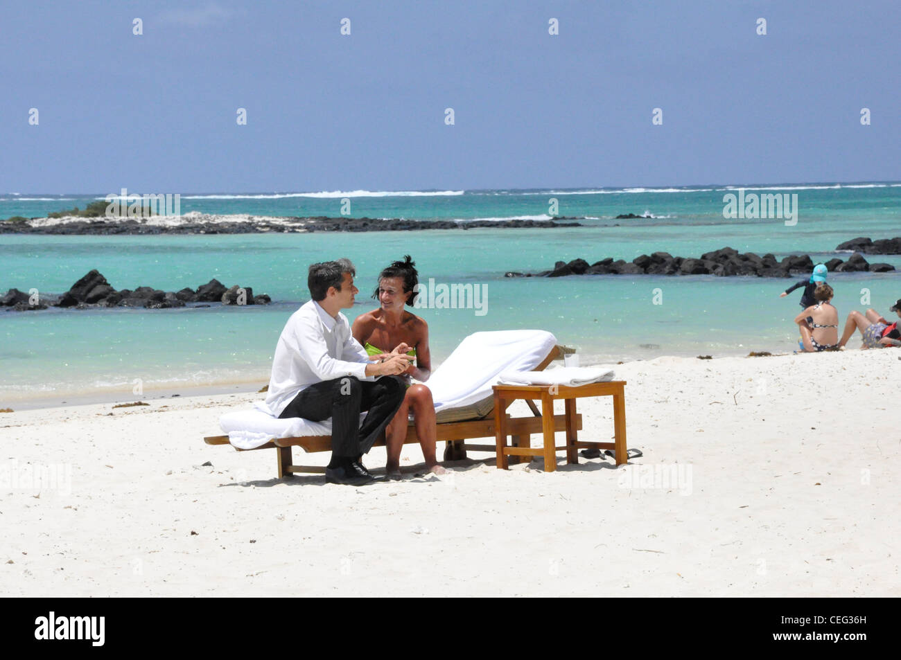 Sun lit beach Chef with hotel guest discussing gastronomy Stock Photo ...