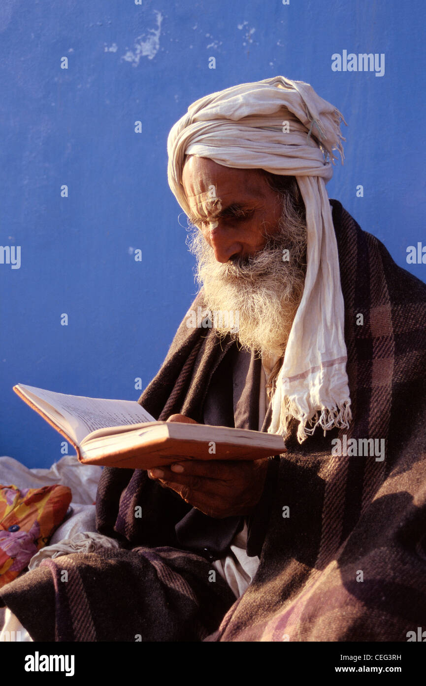 Hindu man ( sadhu) reading a holy book ( India Stock Photo - Alamy