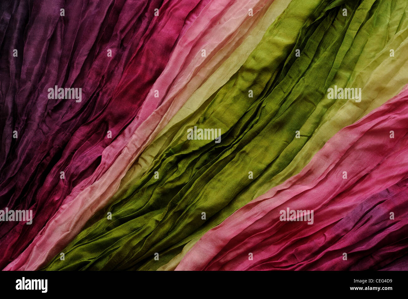 Silk background, lime green and pink to dark red and violet colors ...