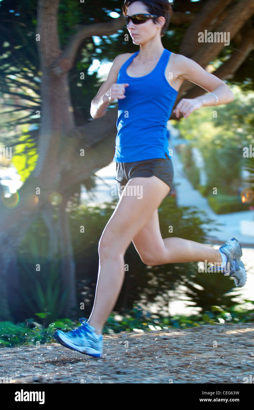 A woman running on a path Stock Photo - Alamy