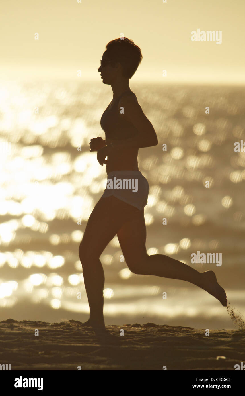 Running sun beach hi-res stock photography and images - Alamy