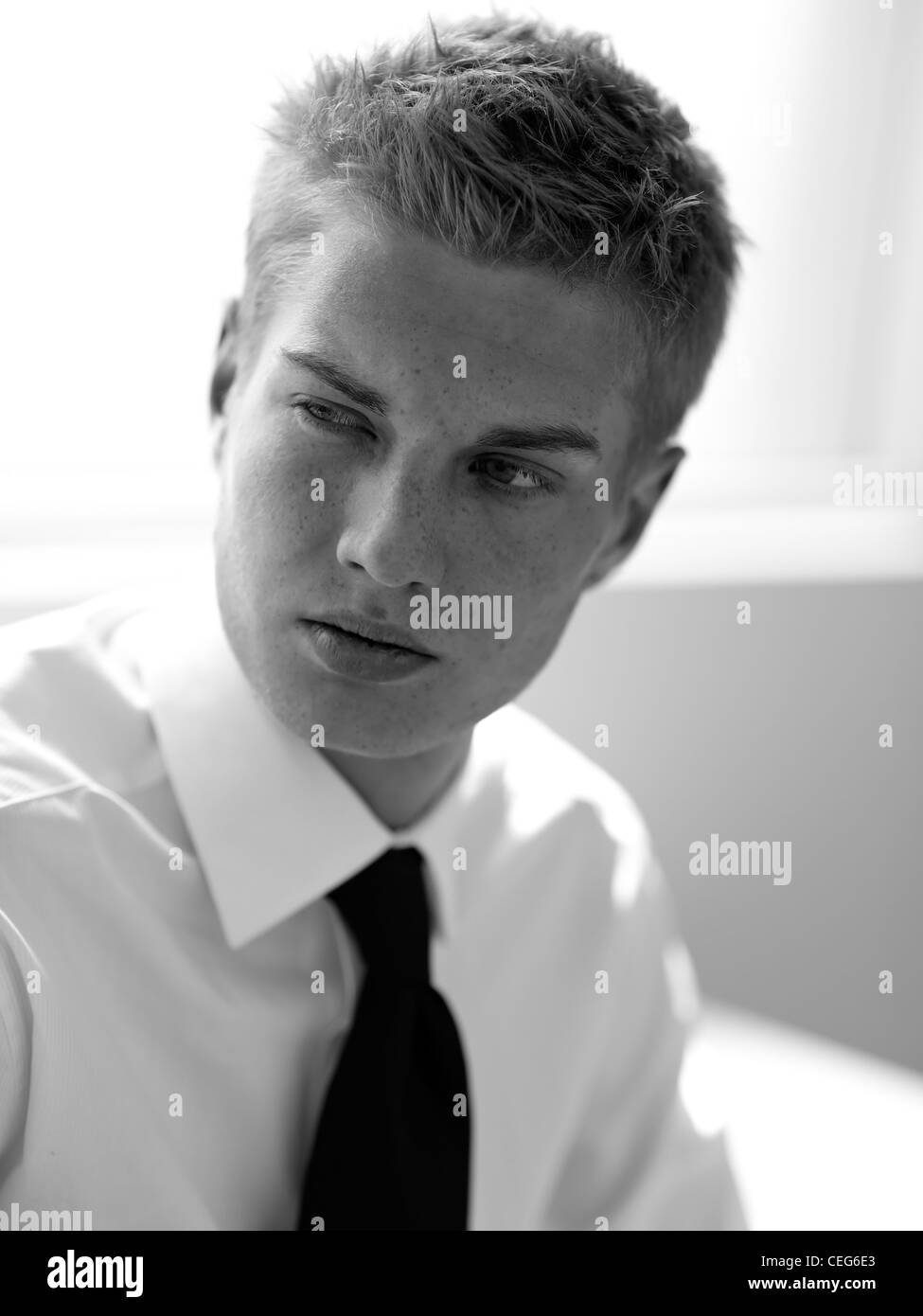 young man looking off camera Stock Photo - Alamy