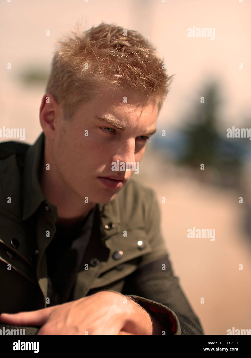 young man looking off camera Stock Photo - Alamy