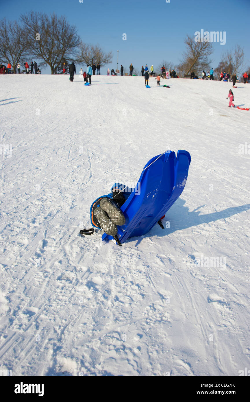 A child little boy sledding downhill winter Stock Photo - Alamy