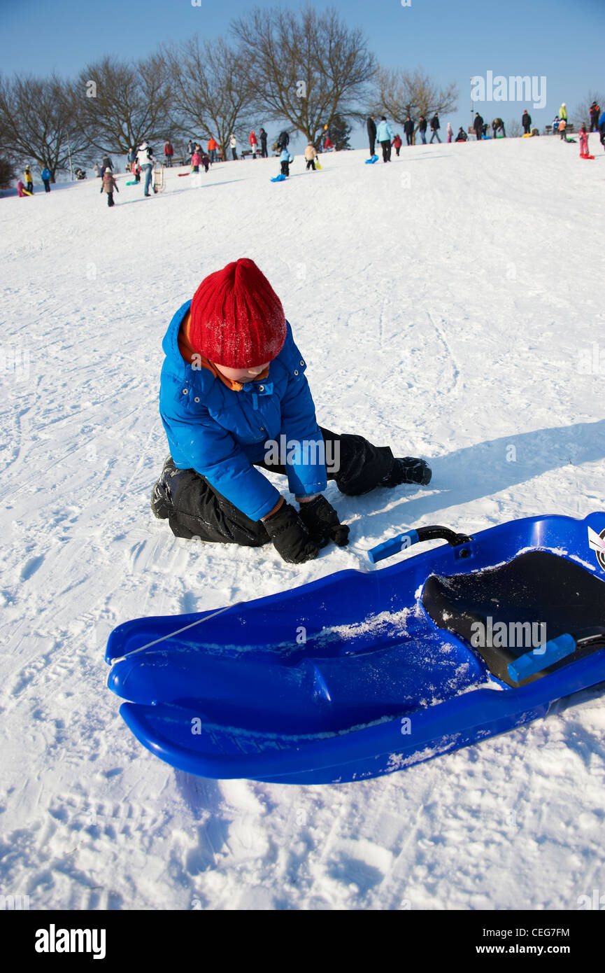 A child little boy sledding downhill winter Stock Photo - Alamy