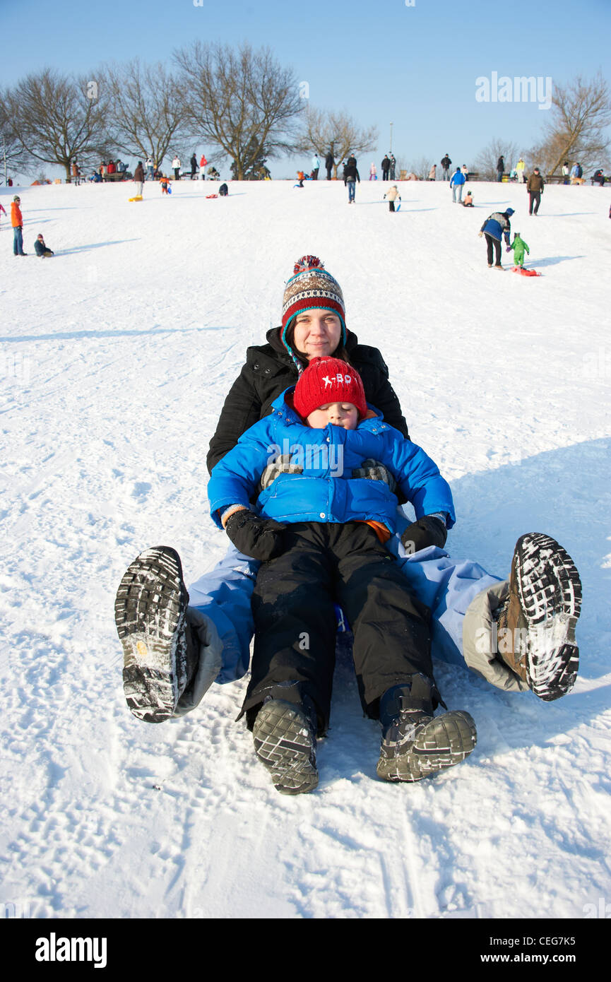 A child little boy sledding downhill winter Stock Photo - Alamy