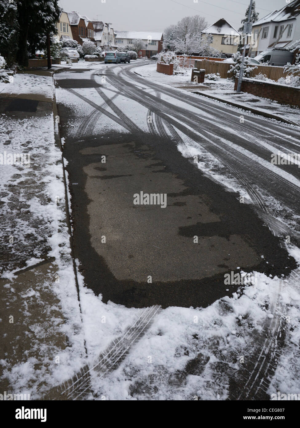 Clear patch of road after parked car has moved off following night of ...