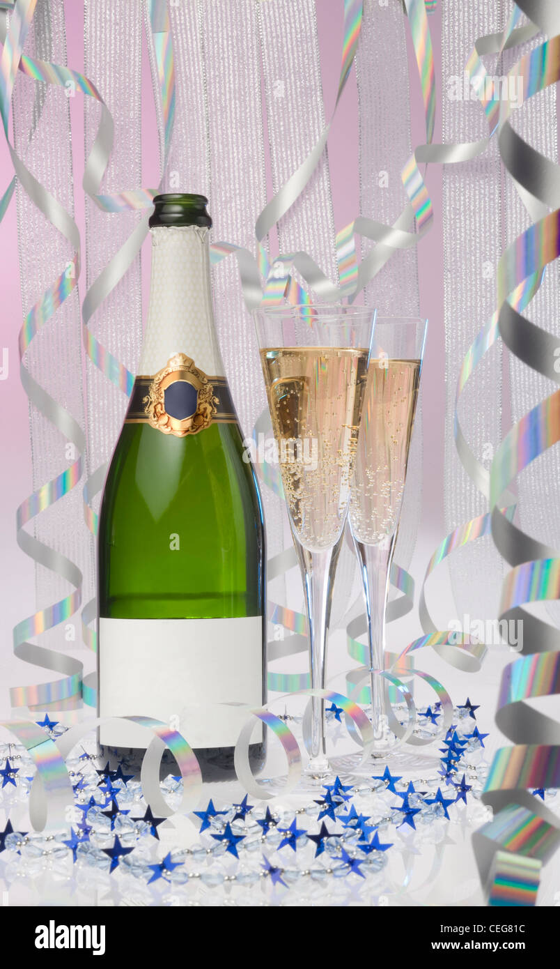 Bottle of Champaign with two flutes and party decorations Stock Photo ...