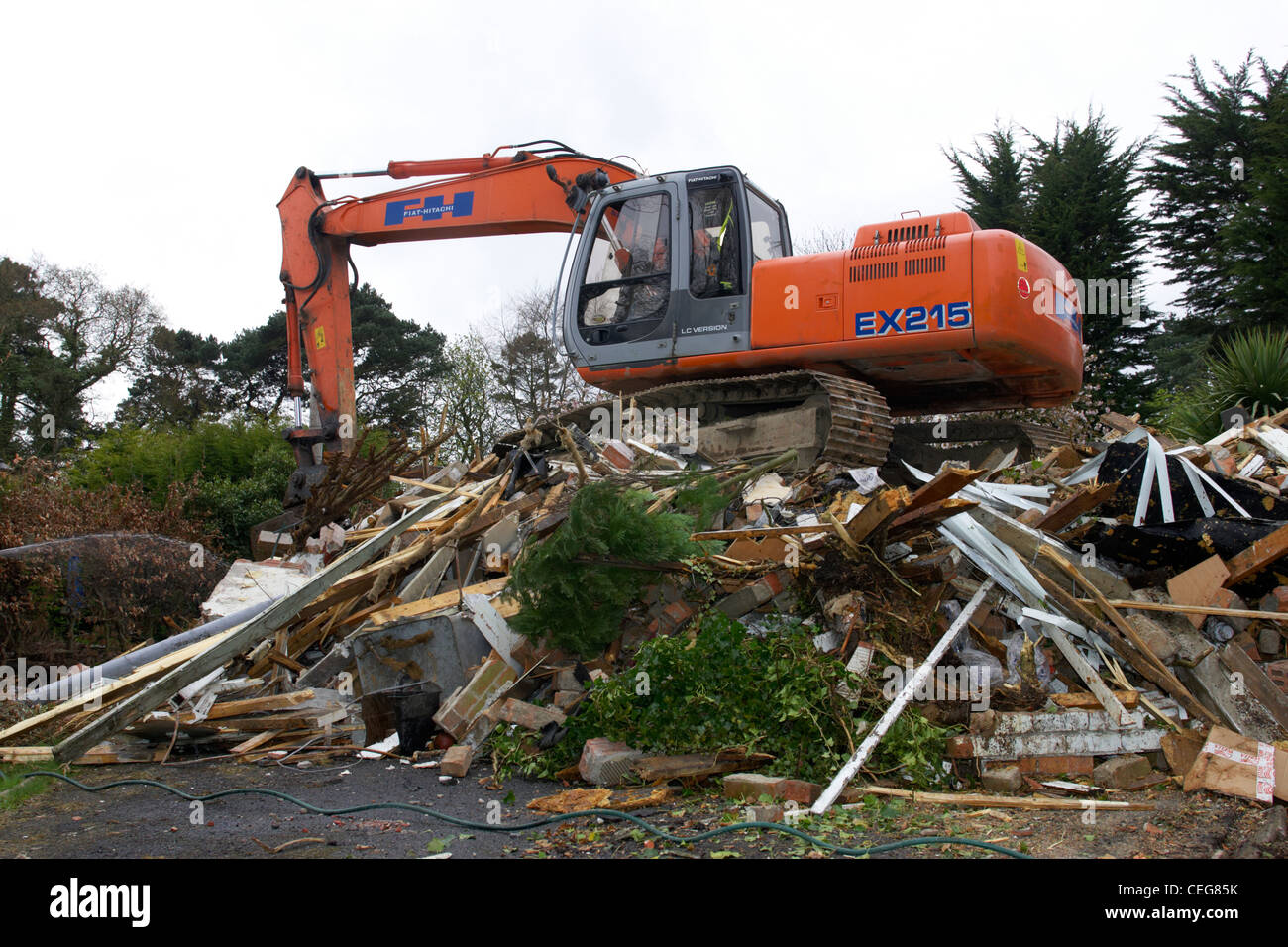 jcb heavy moving excavator earth mover demolishing a building on a ...
