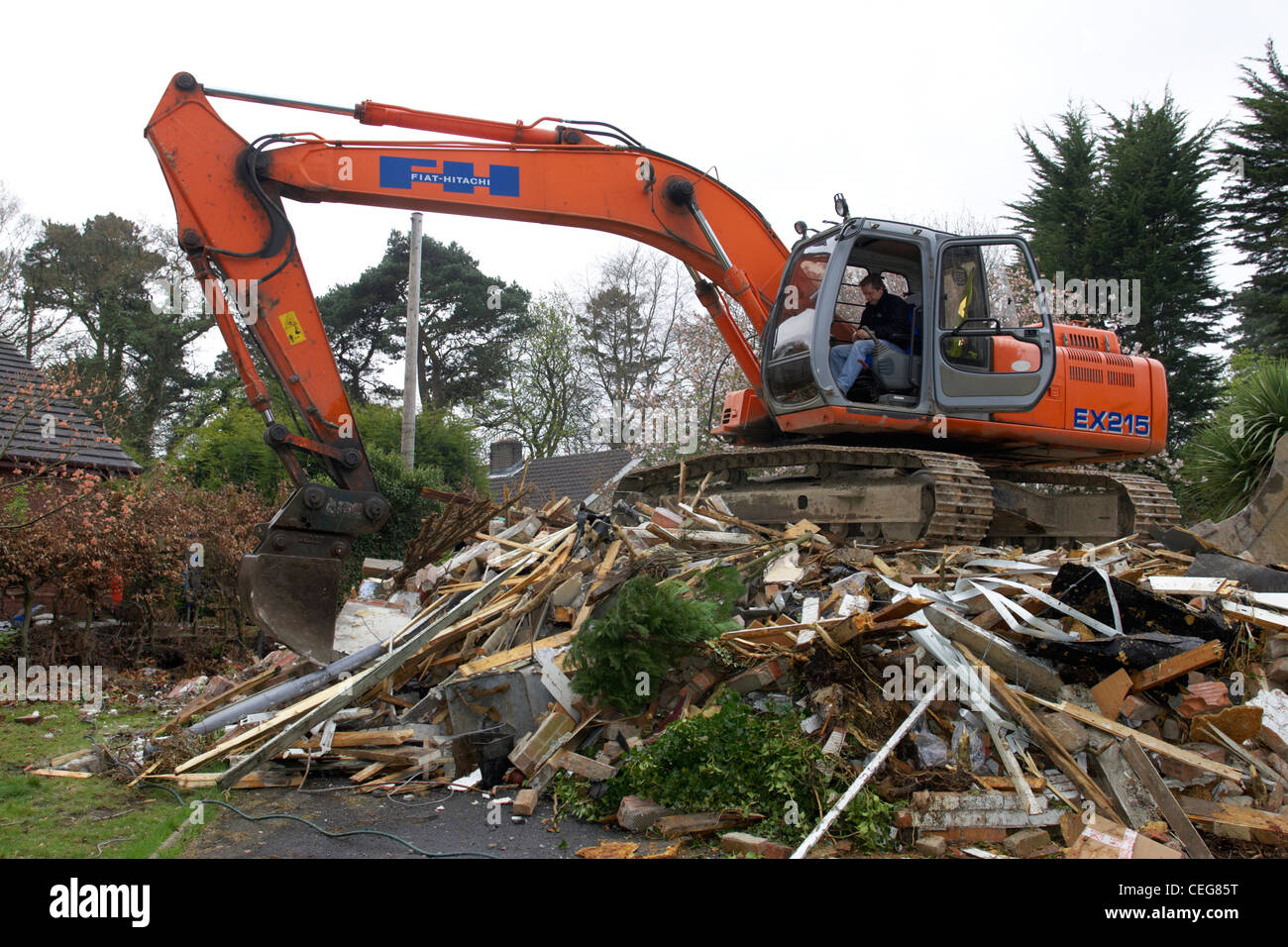 jcb heavy moving excavator earth mover demolishing a building on a ...