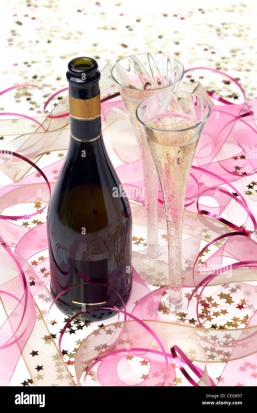 Bottle of Champaign with two flutes and party decorations Stock Photo ...